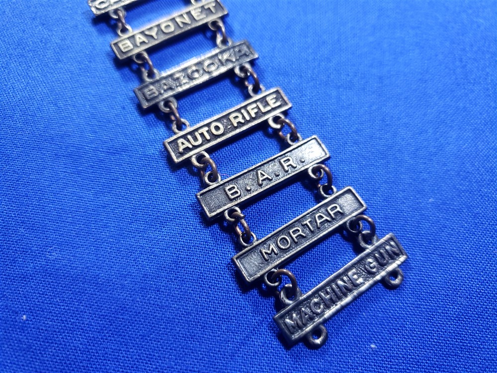 Badge Shrp 9 bars - Doughboy Military Collectables Springfield Missouri
